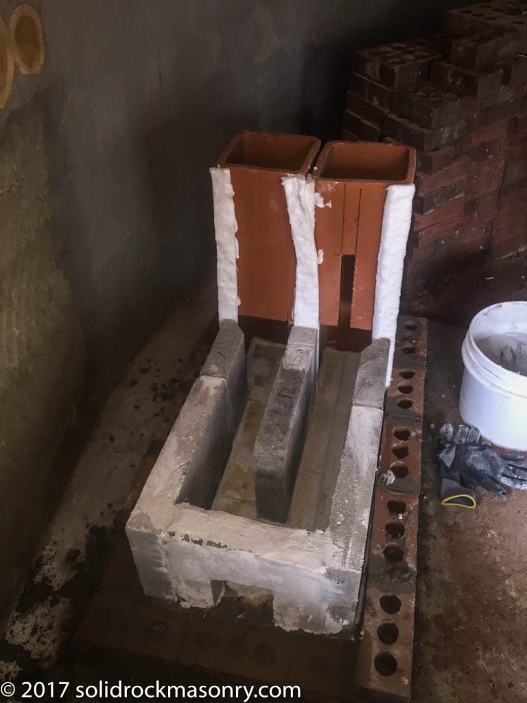 Wall Cabin Cookstove finished with brick | Solid Rock Masonry
